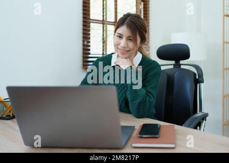 business owner or Asian male marketers are using smart phone and tablet ...