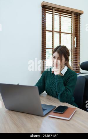 business owner or Asian male marketers are using smart phone and tablet ...