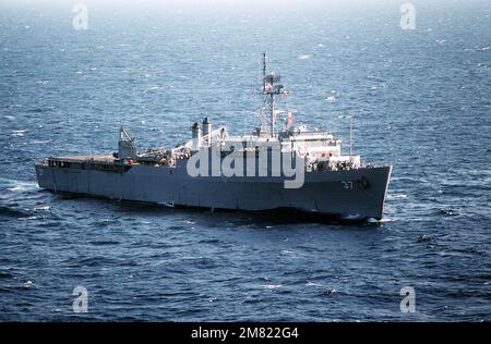 An elevated starboard bow view of the dock landing ship USS PORTLAND ...