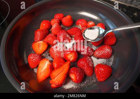 Swabian cuisine, preparation sweet kratzete with flambeed strawberries ...