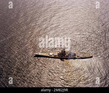 An elevated port beam view of the battleship USS IOWA (BB-61) in Gatun Lake while transiting the ...
