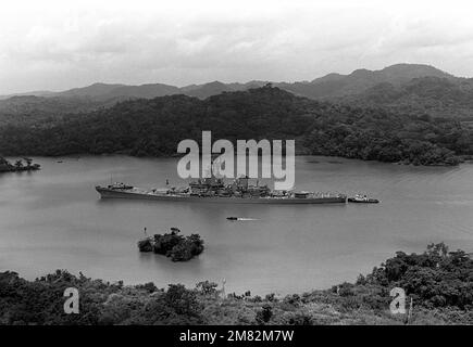 An elevated port beam view of the battleship USS IOWA (BB 61) underway during sea trials ...