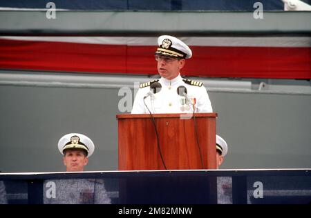 Vice Admiral Joseph Metcalf, Commander of Task Force 120, speaks with a ...