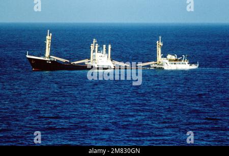 A port side view of the sinking Panamanian ship "SKY ONE". The tank ...
