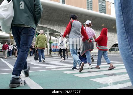 Walking on zebra cross Stock Photo - Alamy