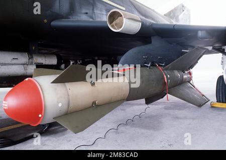 A GBU-15 glide bomb mounted on the wing pylon of an F-4 Phantom II ...