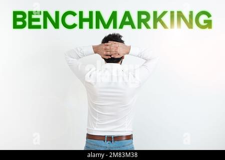Hand writing sign Benchmarking. Business idea Evaluate something by ...