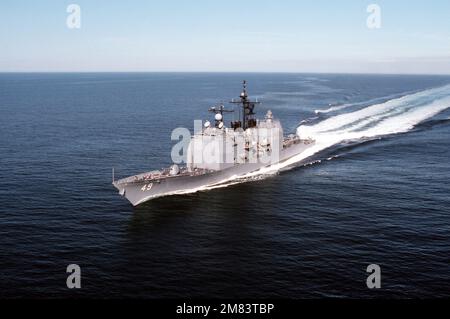 An aerial port bow view of the Aegis guided missile cruiser USS ...