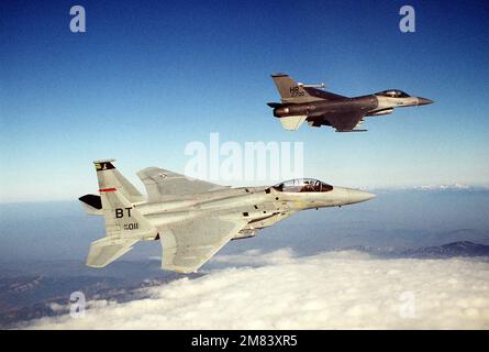 An air-to-air right side view of a 50th Tactical Fighter Wing, 10th ...