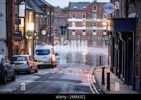 Local business are flooded as heavy rain causes the River Ouse in York ...