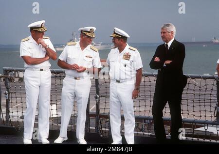 Vice Admiral Joseph Metcalf, Commander of Task Force 120, speaks with a ...