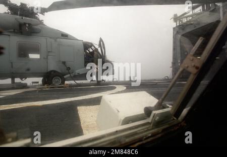 A view from the hangar of the frigate USS TRIPPE (FF-1075) of an SH-2 ...