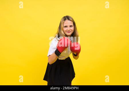 An adorable little girl boxer practicing punches in studio Stock Photo ...