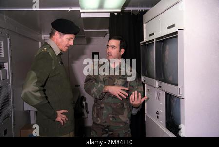 Australian Defense Attache Major General H.J. Coates sits in the driver ...
