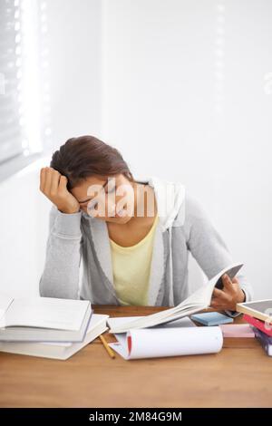 Happy young student reading notes in copybook and recording voice ...