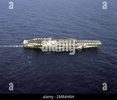 An aerial starboard beam view of the aircraft carrier USS KITTY HAWK ...