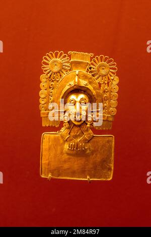 A solid gold pectoral of the Mixtec deity Coo Dzavui or Rain Serpent ...