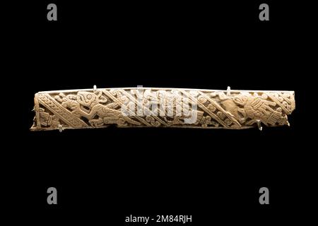 Bone with carved figures used for ritual purposes. Museum of Cultures ...