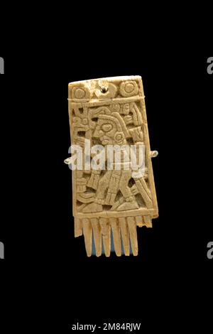 Bone with carved figures used for ritual purposes. Museum of Cultures ...
