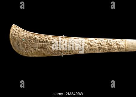 Bone with carved figures used for ritual purposes. Museum of Cultures ...