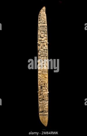 Bone with carved figures used for ritual purposes. Museum of Cultures ...