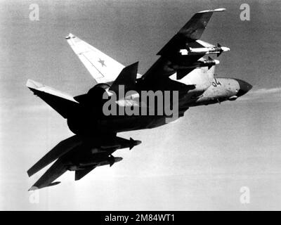 An air-to-air right underside view of a Soviet MiG-25 Foxbat aircraft ...