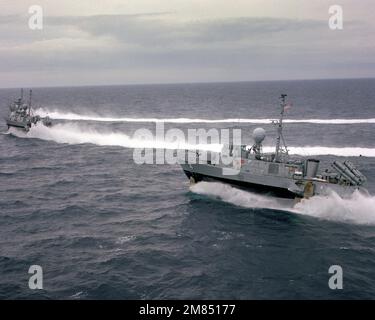 The patrol combatant missile hydrofoils USS TAURUS (PHM-3), foreground ...