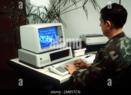 A soldier operates an IBM personal computer at the Theater ...