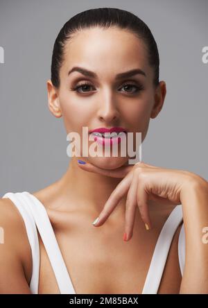Using color to express herself. Studio shot of an attractive young ...
