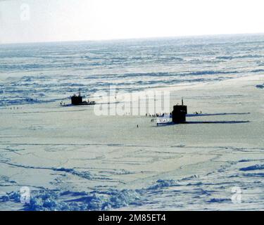 An elevated view of the attack submarines USS RAY (SSN-653), USS ...