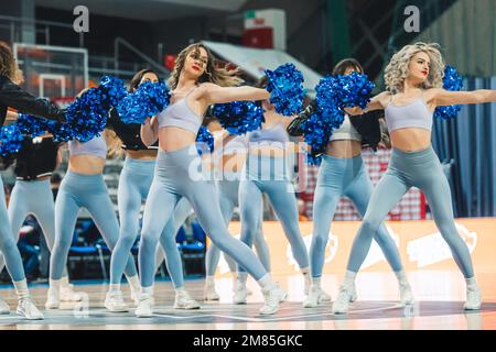 A group of cheerleaders are captured in a dynamic and athletic moment ...