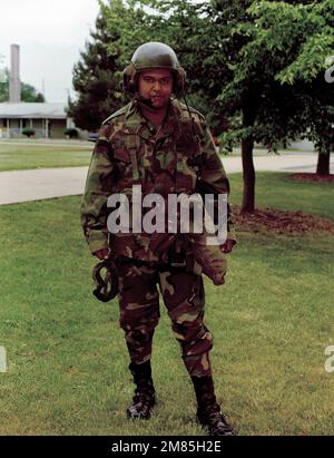 A member of an armored unit models his helmet and uniform at Skidgel ...