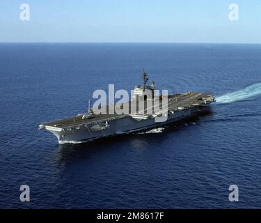 An aerial port bow view of the aircraft carrier USS KITTY HAWK (CV 63 ...
