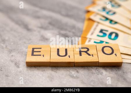 Close-Up Word EURO Is Written In Wooden Letters, Near Part Of 10, 20 ...