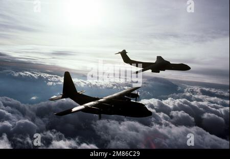 Air to air side view of Air Mobility Command's 375th Military Airlift ...