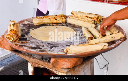 Tlayudas (big roasted tortillas) at a street food stall in Oaxaca city Mexico Stock Photo - Alamy