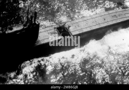 An aerial port amidships view of a damaged Soviet Yankee class nuclear ...