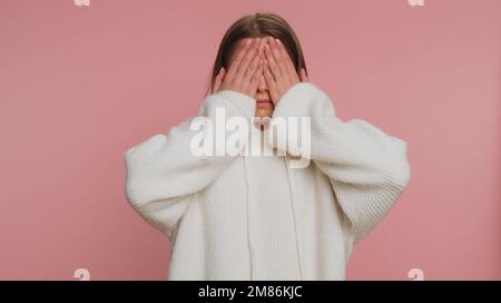 Dont want to look at this, awful. Afraid woman closing eyes with hand ...