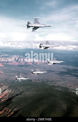 A right side view of an F-16 Fighting Falcon aircraft carrying an AN ...