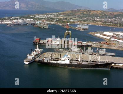 An aerial view of four Military Sealift Command ships moored at the ...