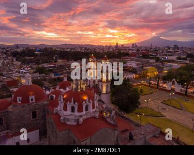 Puebla at Dramatic evening Sunset aerial drone shot of City Center in ...