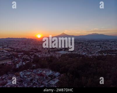 Puebla at Dramatic evening Sunset aerial drone shot of City Center in ...