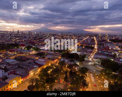 Puebla at Dramatic evening Sunset aerial drone shot of City Center in ...