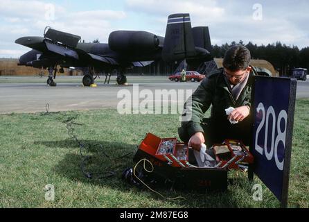 A member of the 91st Aircraft Maintenance Unit (91st AMU) inspects a ...