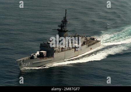 An aerial port bow view of the frigate USS Glover (FF-1098) underway ...