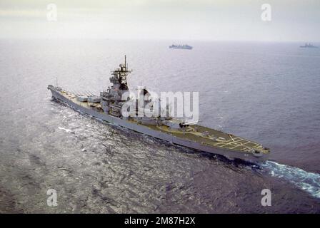 An elevated port quarter view of the battleship USS IOWA (BB 61) underway during sea trials ...