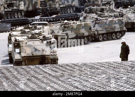 M-113 armored personnel carriers are driven aboard the Ready Reserve ...