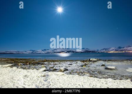 Frozen salt water under full moon, night in the Arctic in freezing ...