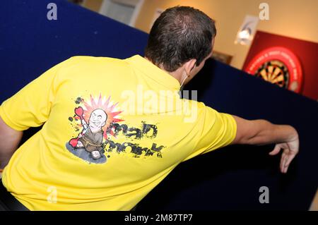 Professional dart player arron monk throwing dart uk Stock Photo - Alamy