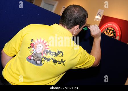 Professional dart player arron monk throwing dart uk Stock Photo - Alamy